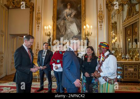 Amazon Indigenous leader Domingo Peas (right), presents a gift to King ...