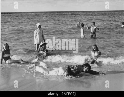 The Beatles, working on a movie in Nassau, Bahamas, went swimming in a ...