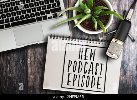 top view of podcast recording equipment on rustic wooden table with ...