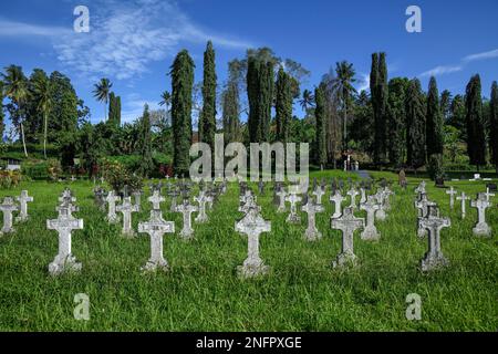 Graves on the cemetery of the Catholic mission of Vunapope, Kokopo ...