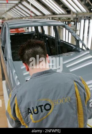 Worker at production of Tiguan and Touran at Auto 5000 Gmbh Stock Photo ...