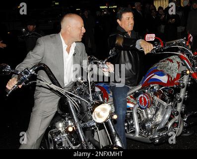 Actors Bruce Willis, left, and Sylvester Stallone ride motorcycles ...