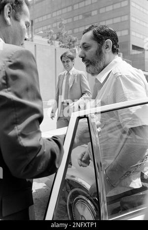 Convicted murderer Joseph Kallinger is escorted in handcuffs by police ...