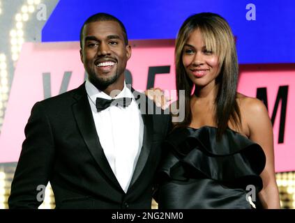 Kanye West, left, and his fiance Alexis Phifer arrive at the MTV Video ...