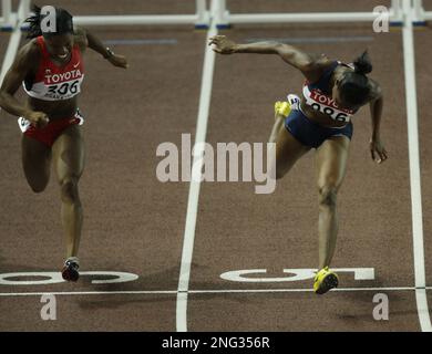 Canada's Perdita Felicien, left, and USA's Michelle Perry cross the ...