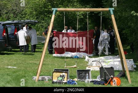 dead bodies wrapped in white cloth waiting to be identified after ...