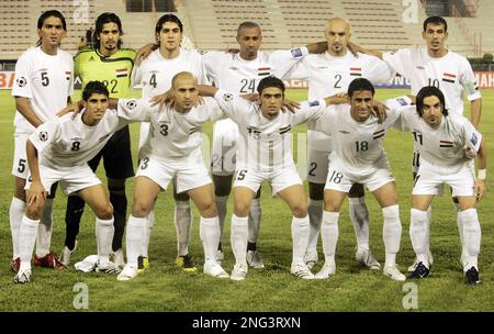 Iraq's soccer players Younes Khalef, left, and Nashat Ali celebrate ...
