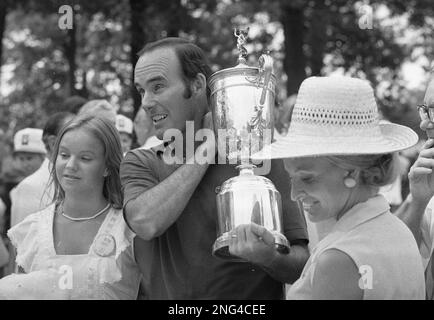 Lou Graham is flanked by his daughter, Louanne, left, and his wife ...