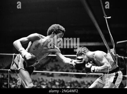 Panamanian boxer Hilario Zapata, left, strikes Japanese boxer Shuichi ...