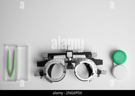 Different ophthalmologist tools on white background, flat lay Stock ...