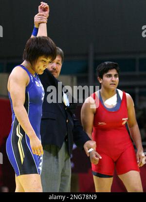 Japan's Kaori Icho (R) is declared the winner over Valeriia Koblova Zholobova of Russia (L) in ...