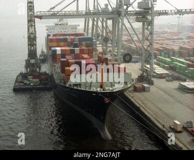 The new container ship 'Hannover Express' is unloaded by cranes in the ...