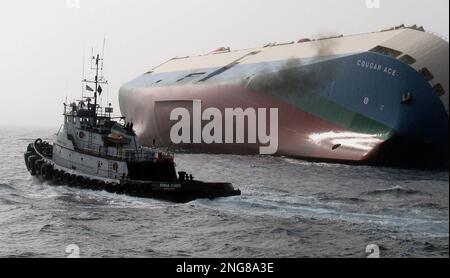 The Cougar Ace, a 654-foot Singapore flagged car carrier, sailed from ...
