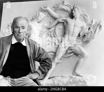 Arno Breker, German sculptor, working on a bust of Gerhart Hauptmann ...