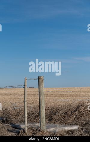 Wire fence around farm field Stock Photo - Alamy
