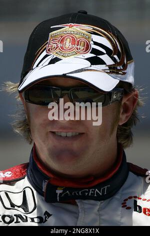 Indy Racing League driver Buddy Lazier of Vail, Colo. is hugged by his ...