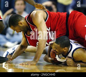 Georgia Tech's B. J. Elder (1) goes up against George Washington's J. R ...