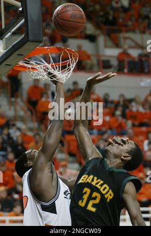 Oklahoma State forward David Monds (32) grabs a rebound as Texas ...