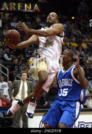 Georgia Tech's B. J. Elder (1) goes up against George Washington's J. R ...