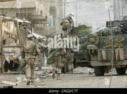 US Marines try to push into the center of Fallujah, Iraq, Friday, Nov ...