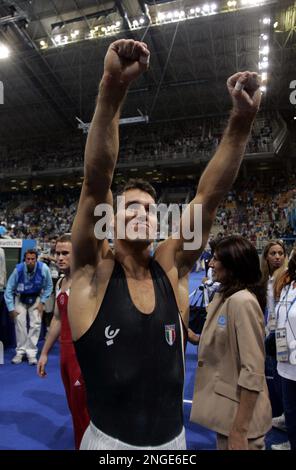 Igor Cassini of Italy acknowledges the crowd after his gold medal win ...