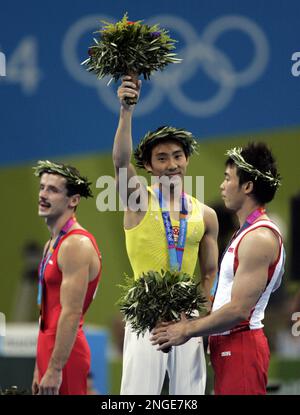 Silver medal winner Marius Daniel Urzica of Romania, left, gold medal ...