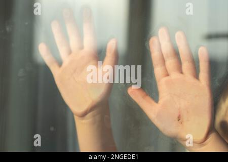 Children's hand with a notch on the glass during quarantine Stock Photo ...