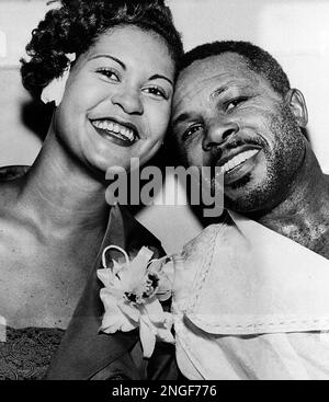 Light heavyweight boxing champion Archie Moore holds is newborn ...