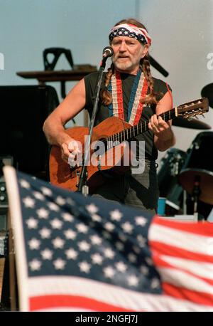 American flag waving on the corner of private residential house, symbol ...
