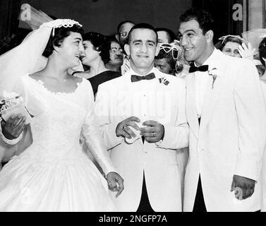 Heavyweight champion Rocky Marciano (center), with his wife Barbara ...