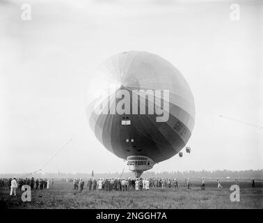 The giant German dirigible, Graf Zeppelin, is pulled down from the air ...