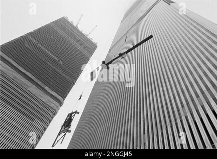 A 36-foot long, 4-ton column is hoisted atop the new world's tallest ...