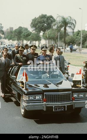 Egyptian President Anwar el-Sadat waves as he departs from a state ...