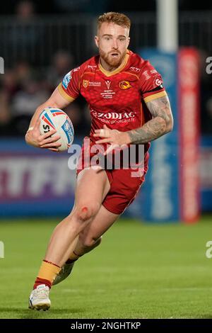 Adam Keighran #3 of Catalans Dragons tackles Marc Sneyd #7 of Salford ...