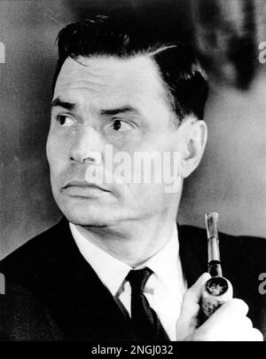 American Nazi George Lincoln Rockwell in front of the Swastika-marked ...