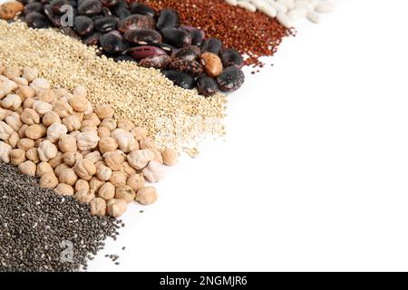 Various raw veggie seeds on white background Stock Photo - Alamy