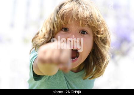 Kid boy with angry expression. Angry hateful little aggression boy ...