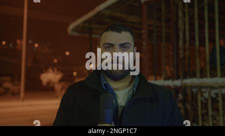 Broad-Shouldered Male Reporter Delivering Bad News in Snowy Background ...