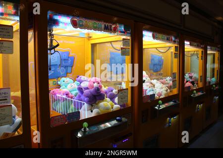 Arcade claw game machines with Care Bears characters Stock Photo - Alamy