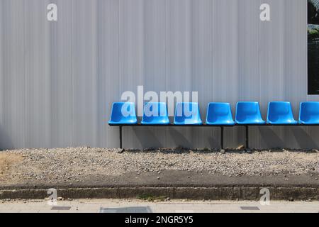 Blue bus stop seats Stock Photo - Alamy