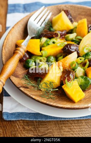 Roasted Yellow Beets with Brussels Sprouts and Dates Stock Photo - Alamy