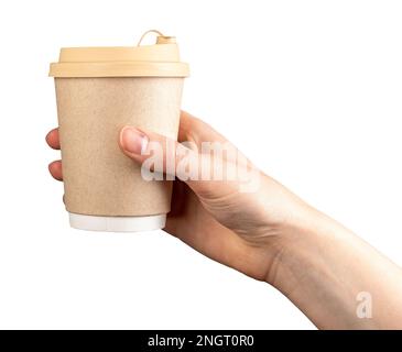Hand holding takeaway cup, kraft paper mug, takeout coffee on black ...