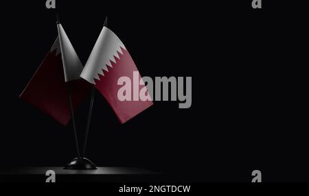 Small national flags of the Qatar on a white background Stock Photo - Alamy