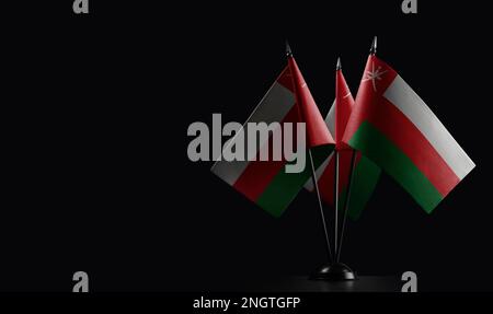 Small national flags of the Oman on a black background Stock Photo - Alamy