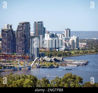 Perth Central Business District and Elizabeth Quay bridge with train in ...