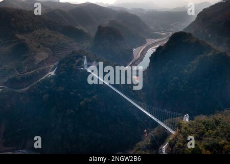 Admire the Bach Long Glass Bridge in the sunset from above. This is the ...