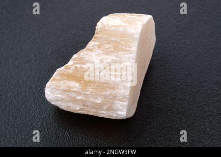 An unworked fragment of red gypsum, black background Stock Photo - Alamy
