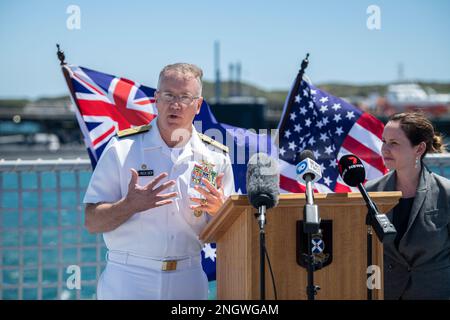 US Navy Commander, Submarine Group Seven, Rear Adm. John Donnelly, center, and USS Frank Cable ...