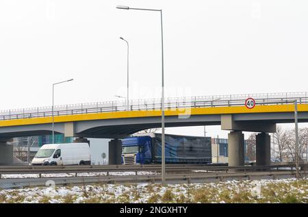 Trucks drive under the transport bridge. Transport logistics Stock ...