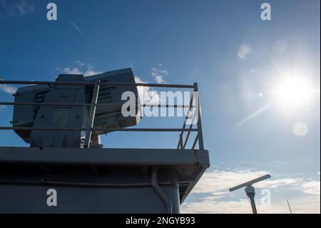 A rolling airframe missile (RAM) launcher fires a RIM-116 missile from ...